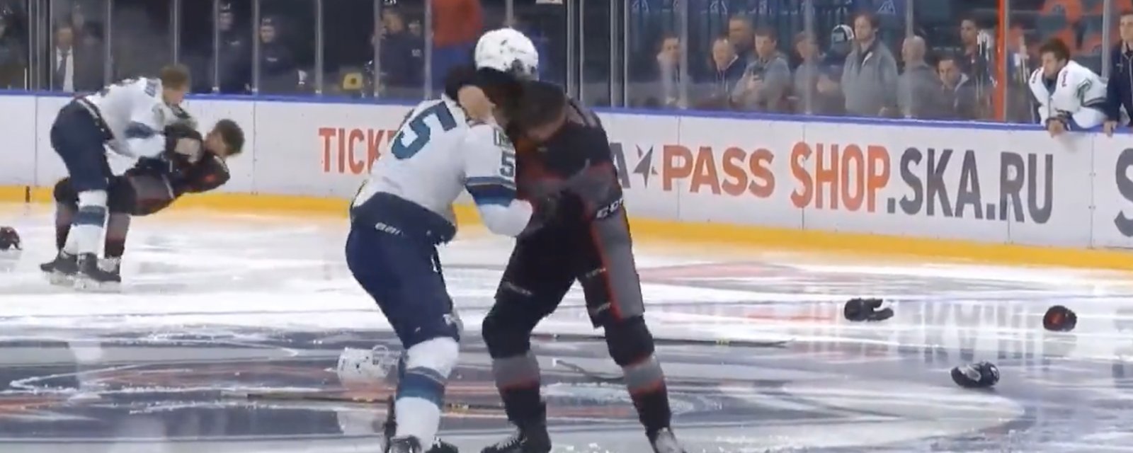 KHL game kicks off with intense line brawl after opening face-off - HockeyFeed