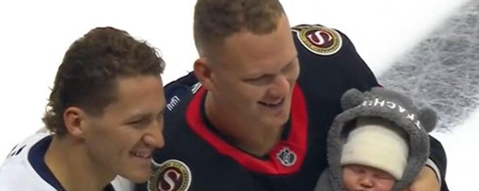The Tkachuk brothers pause warmup to take a family photo with Brady's ...