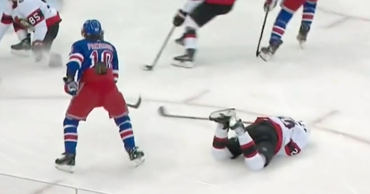 Travis Hamonic in agony after taking puck to the throat - HockeyFeed