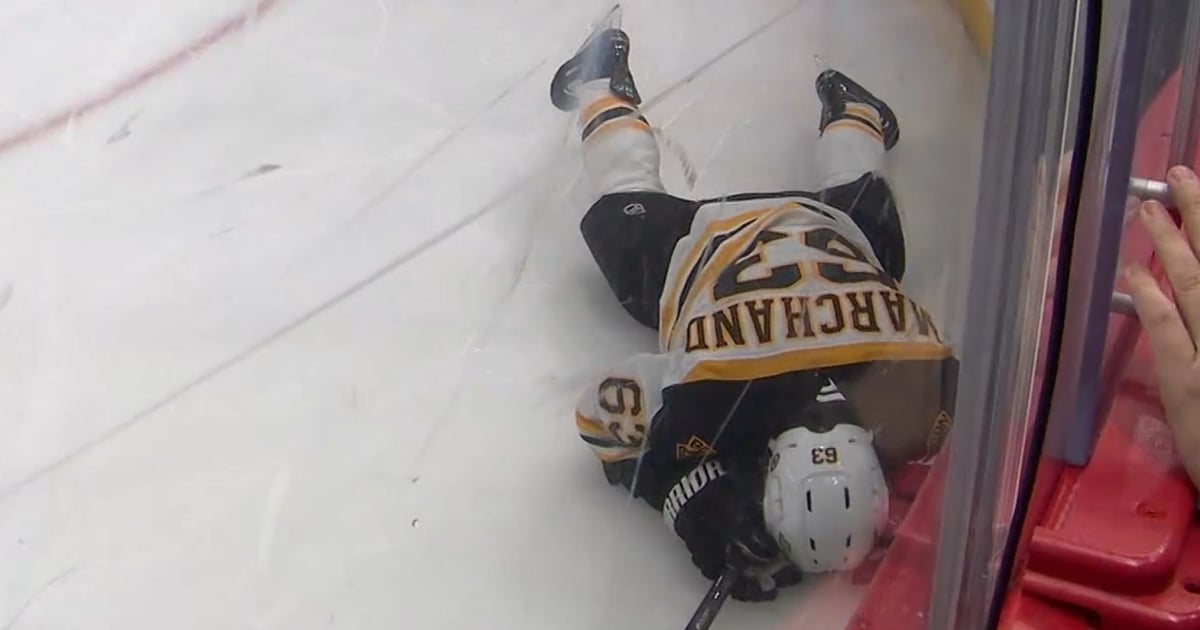 Brad Marchand helped off the ice after hit from P.O. Joseph. - HockeyFeed