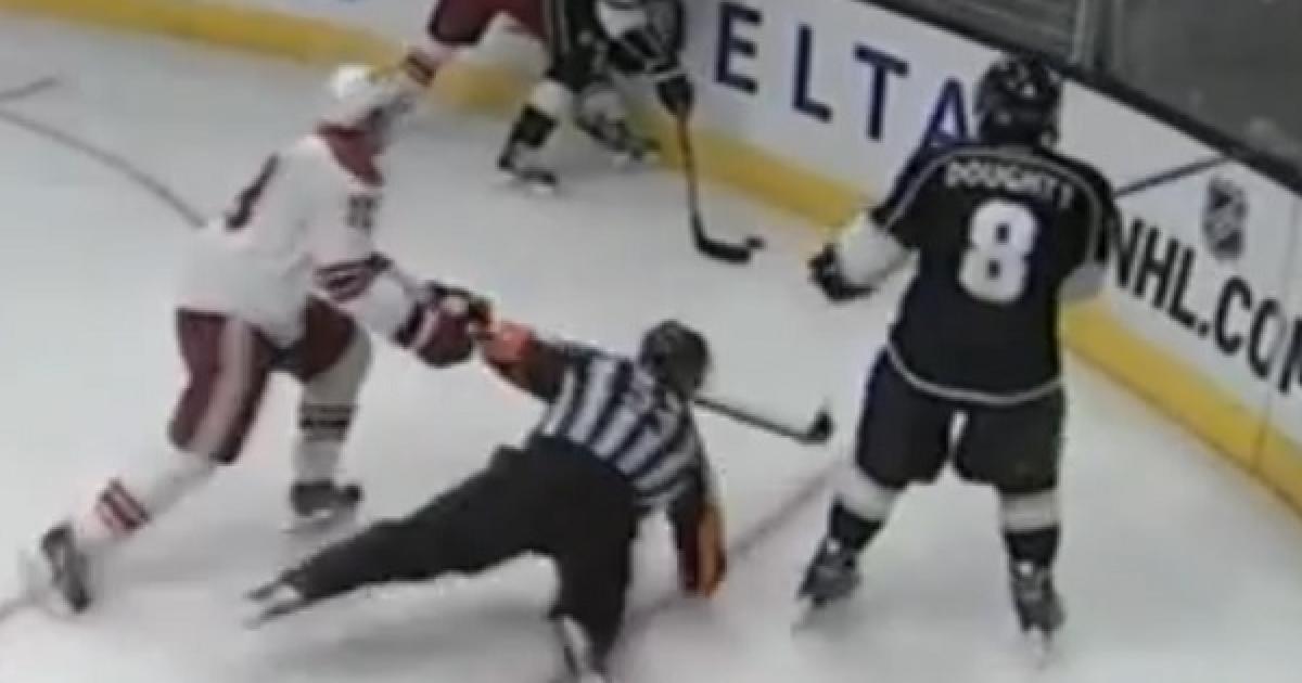Video: Referee takes a hit in the back and loses a tooth. - HockeyFeed